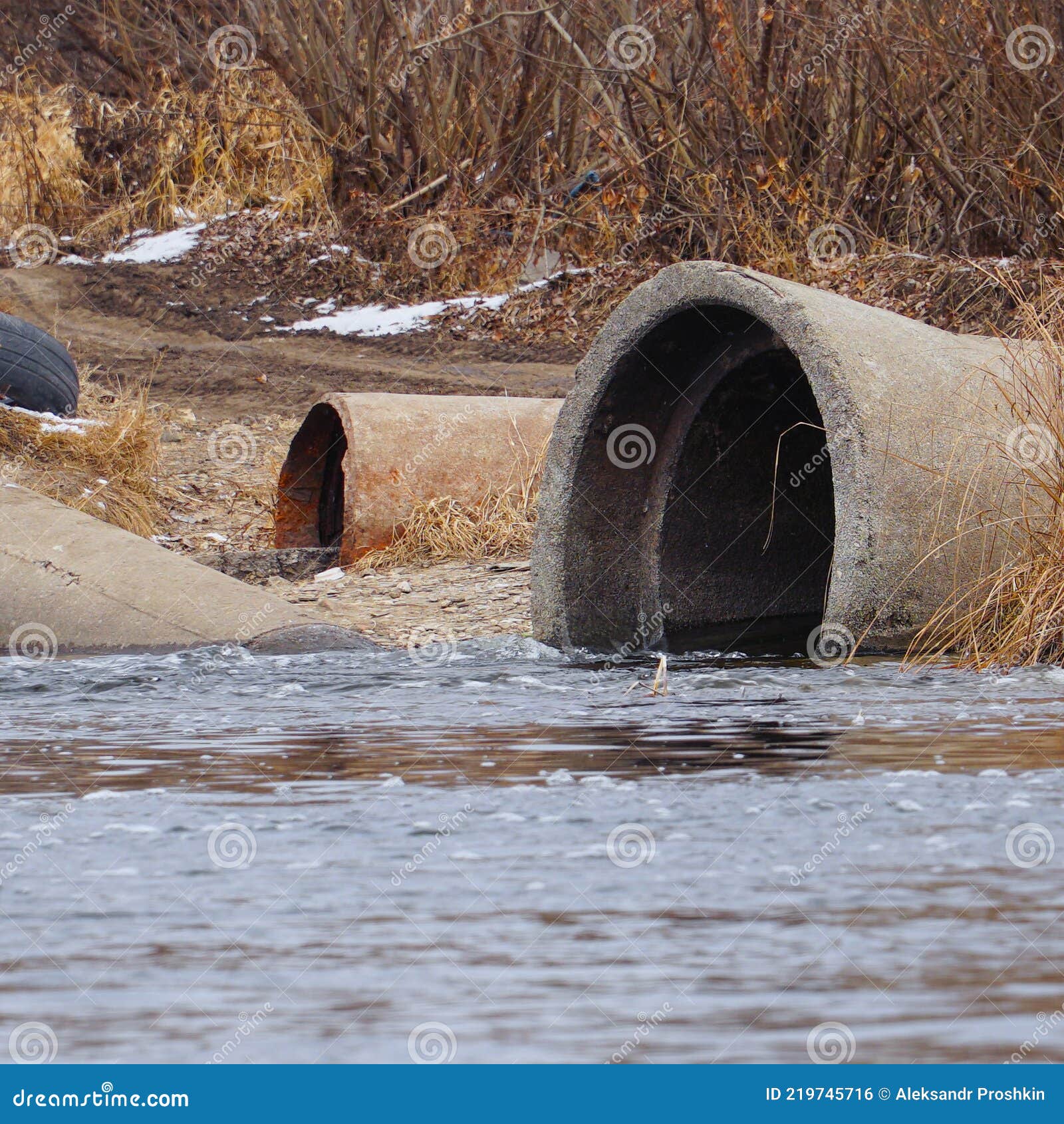 The Water on the River Flows from Large Pipes. Dam on River Stock Photo ...