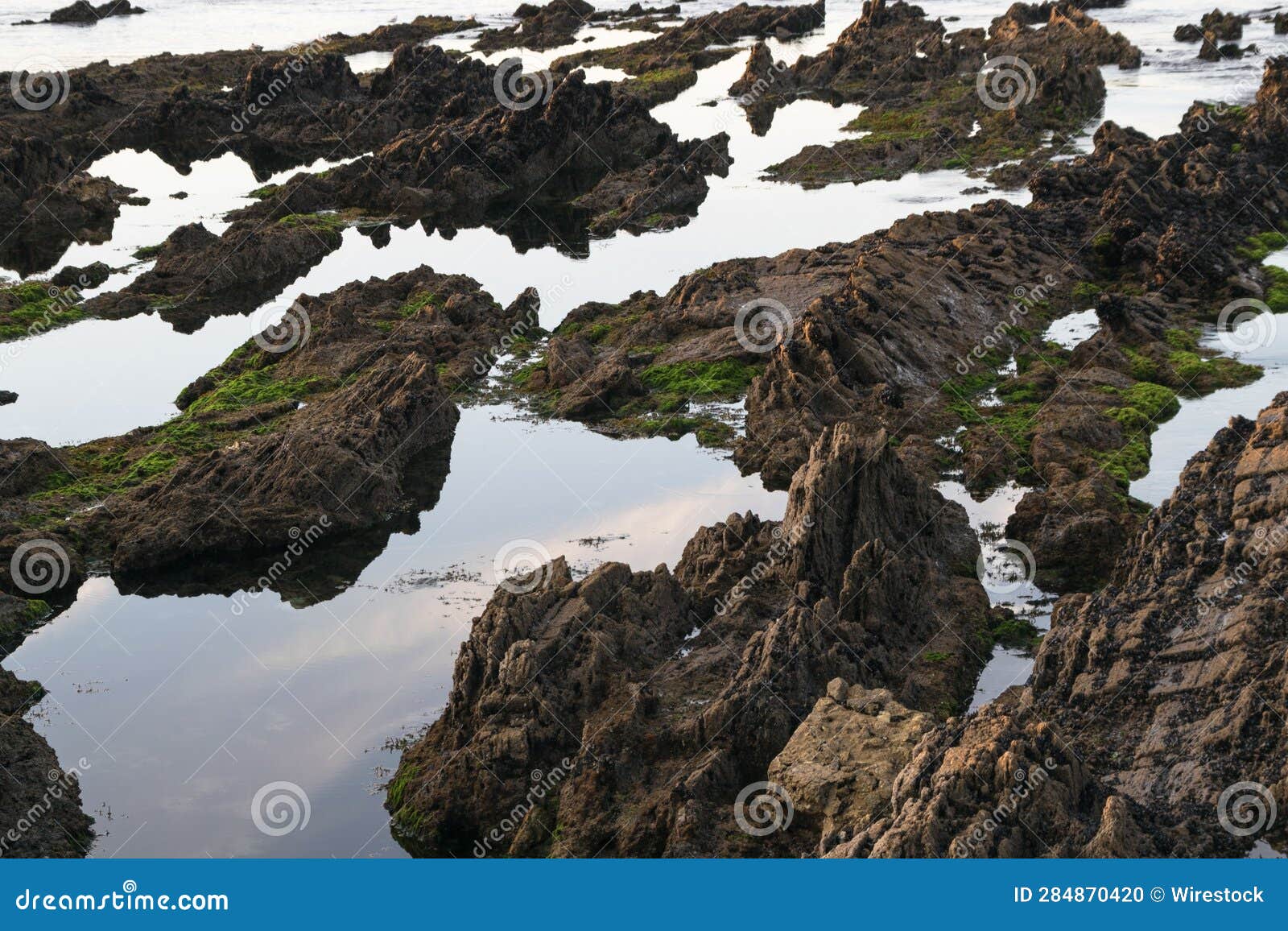 Water between a Rock Formation on the Seashore. Stock Photo - Image of ...