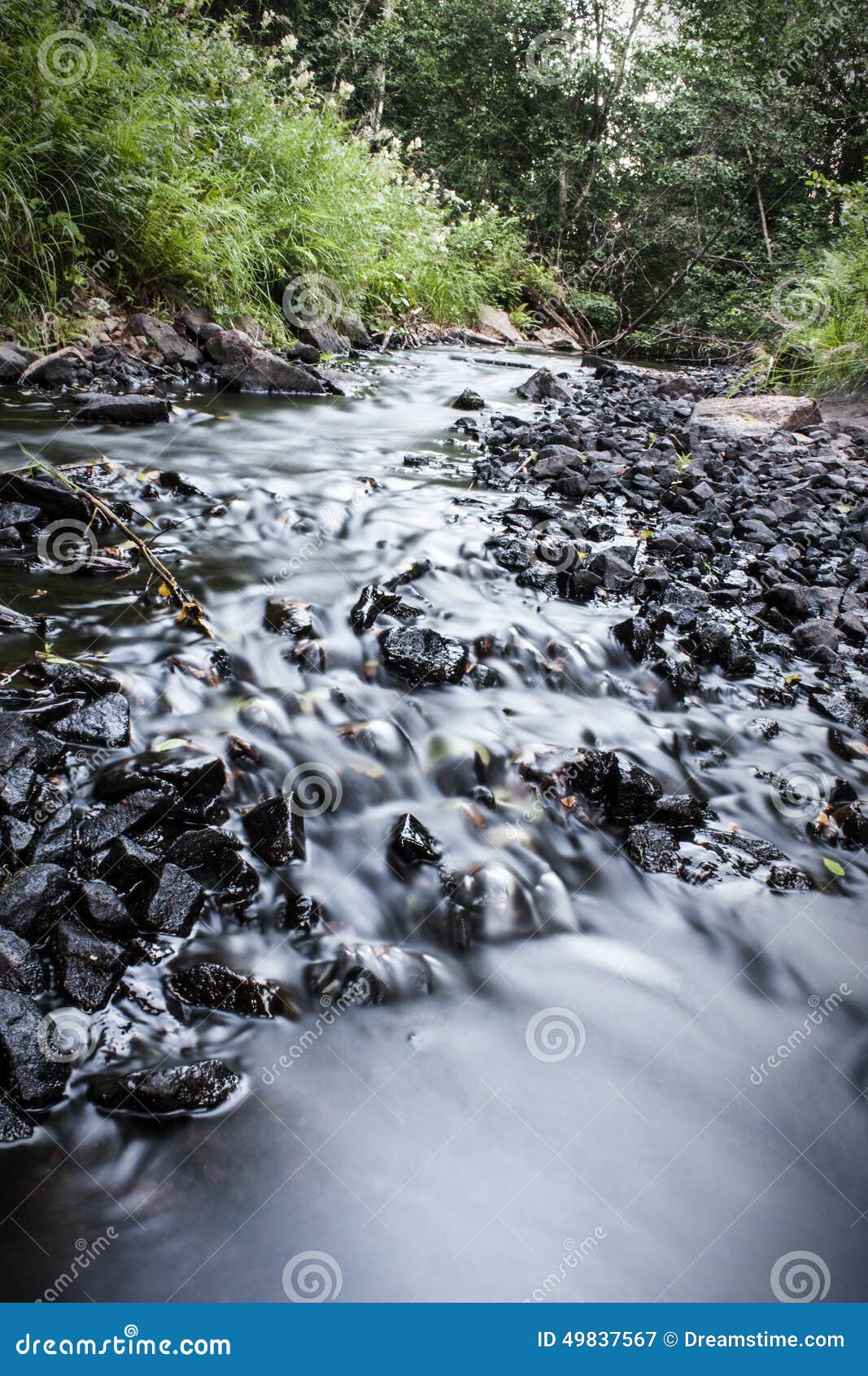 Water Running through Rocks Stock Image - Image of rippling, stream ...