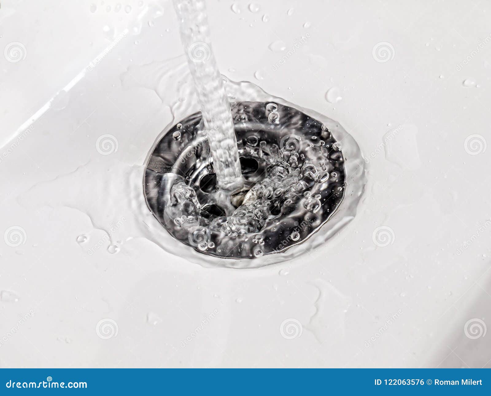Water Running into Washbasin Drain Stock Photo - Image of water, wash ...