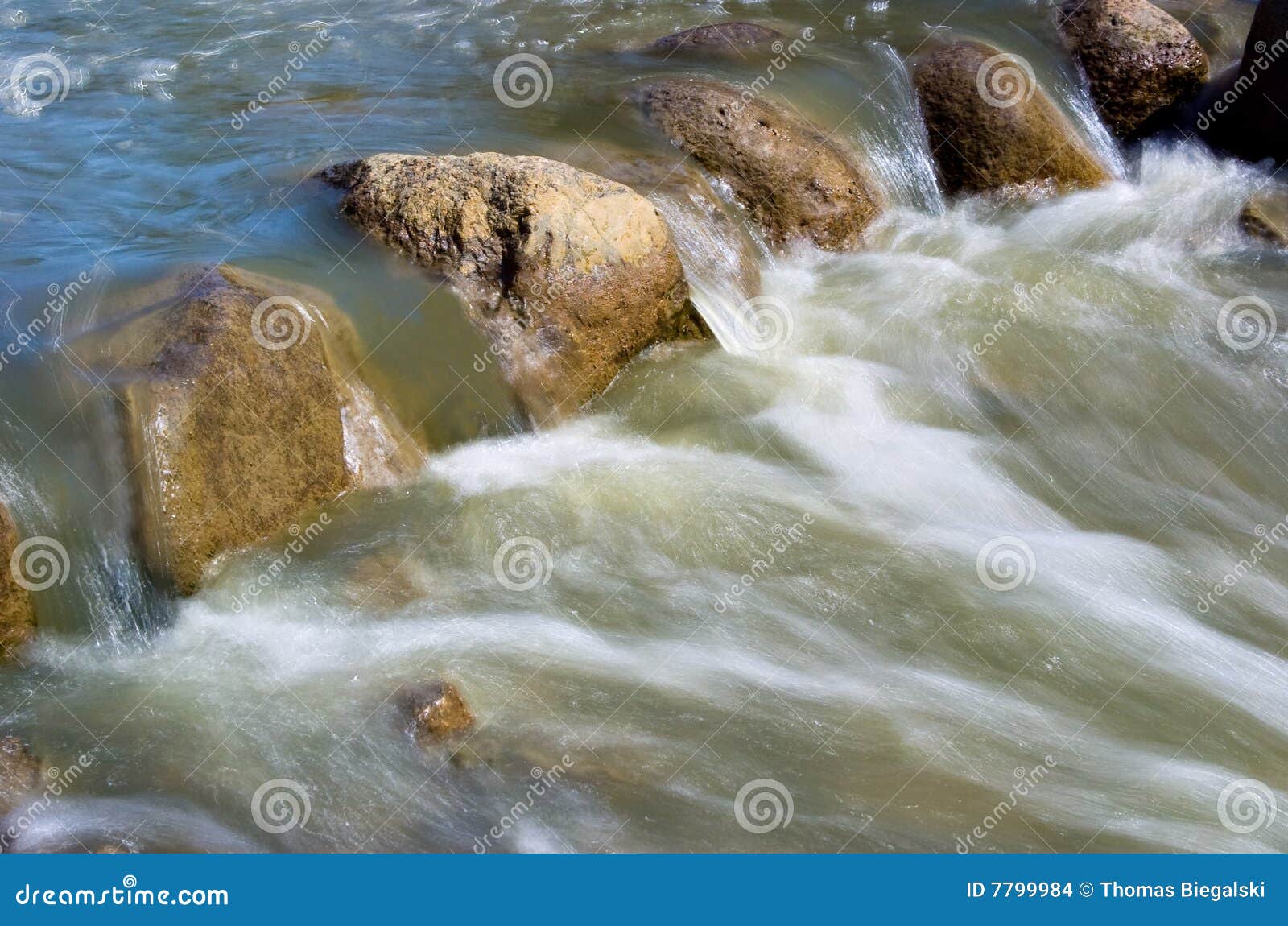Water rushing over rocks stock photo. Image of current - 7799984