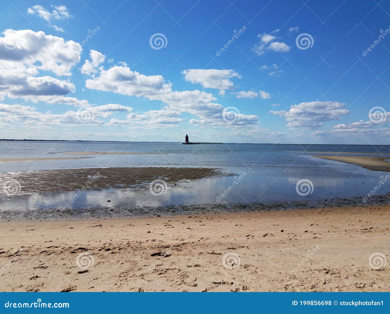 Water and Sand and Lighthouse at Ocean Stock Photo - Image of sand ...