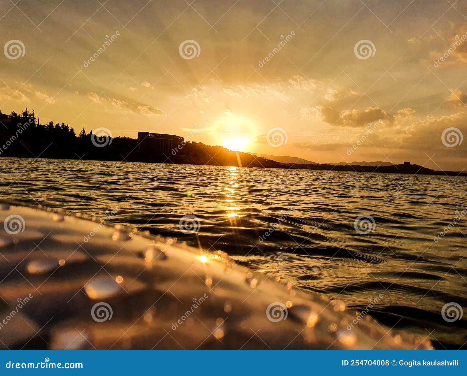 Water send and sun stock photo. Image of sunrise, reflection - 254704008