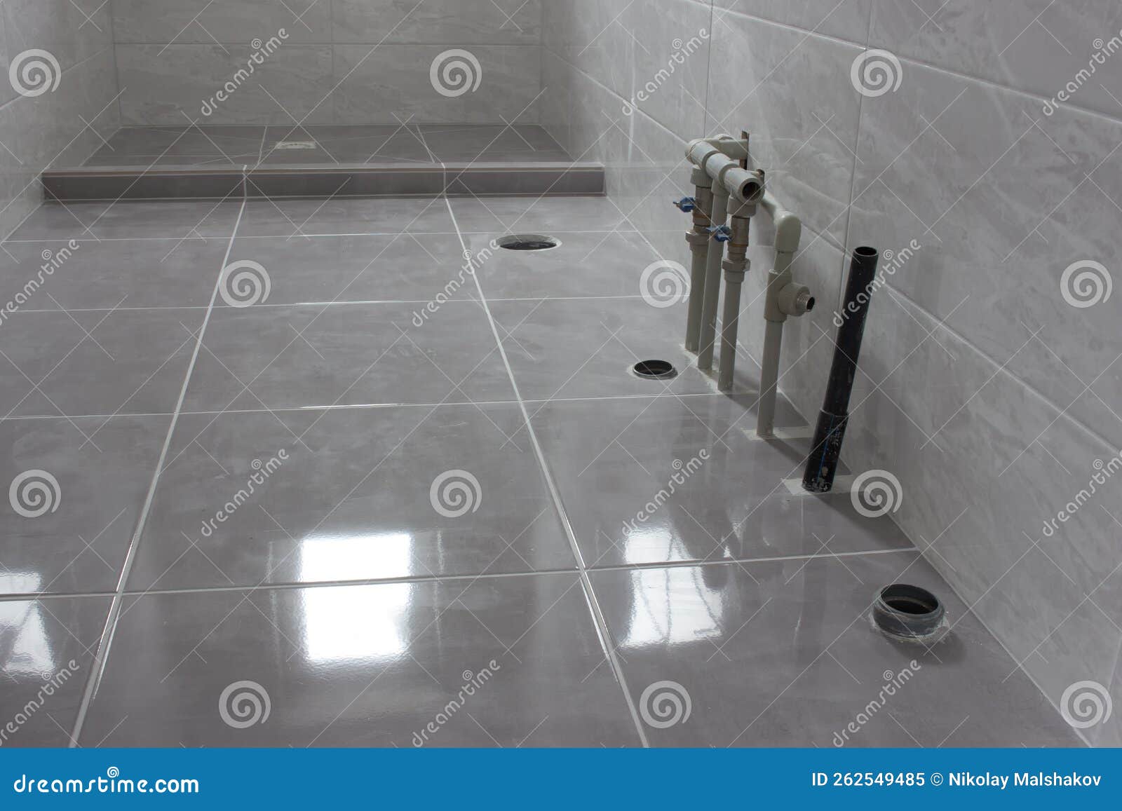 Water and Sewer Pipes in the New Bathroom. Empty Bathroom after ...