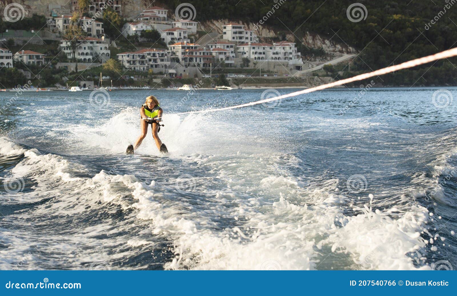 A Young Woman Water Skiing. Stock Photo - Image of jacket, tourist ...