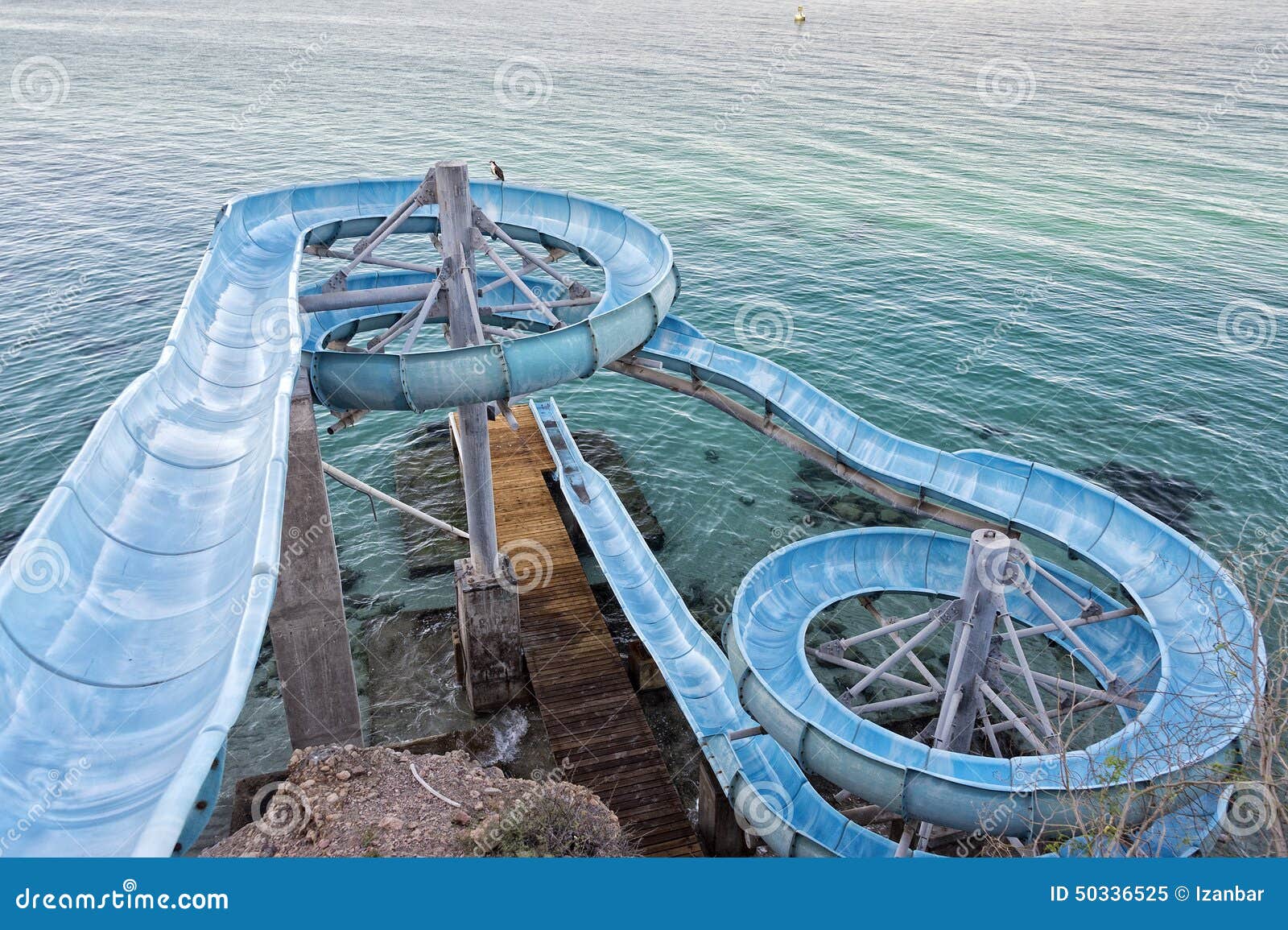 Water slide by the sea stock image. Image of pool, splash - 50336525