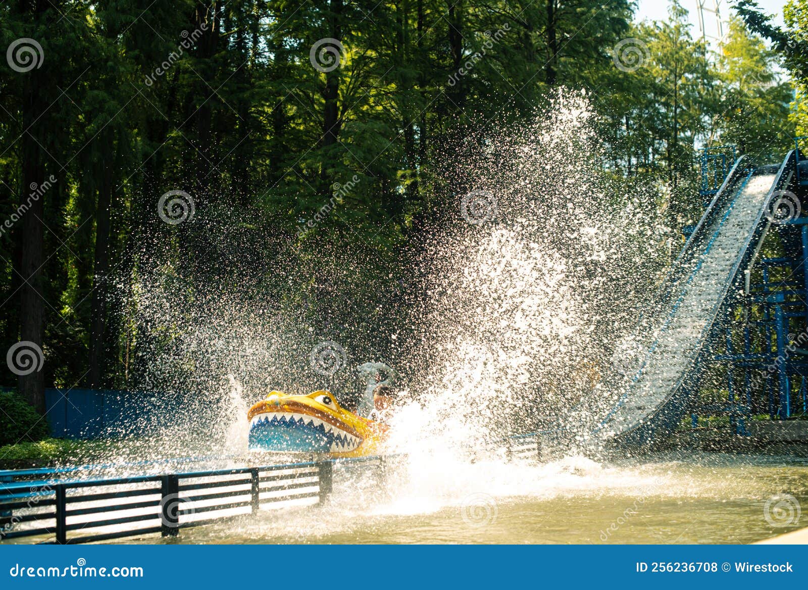 Water Slide with a Sunlit Splash Underneath Stock Photo - Image of ...
