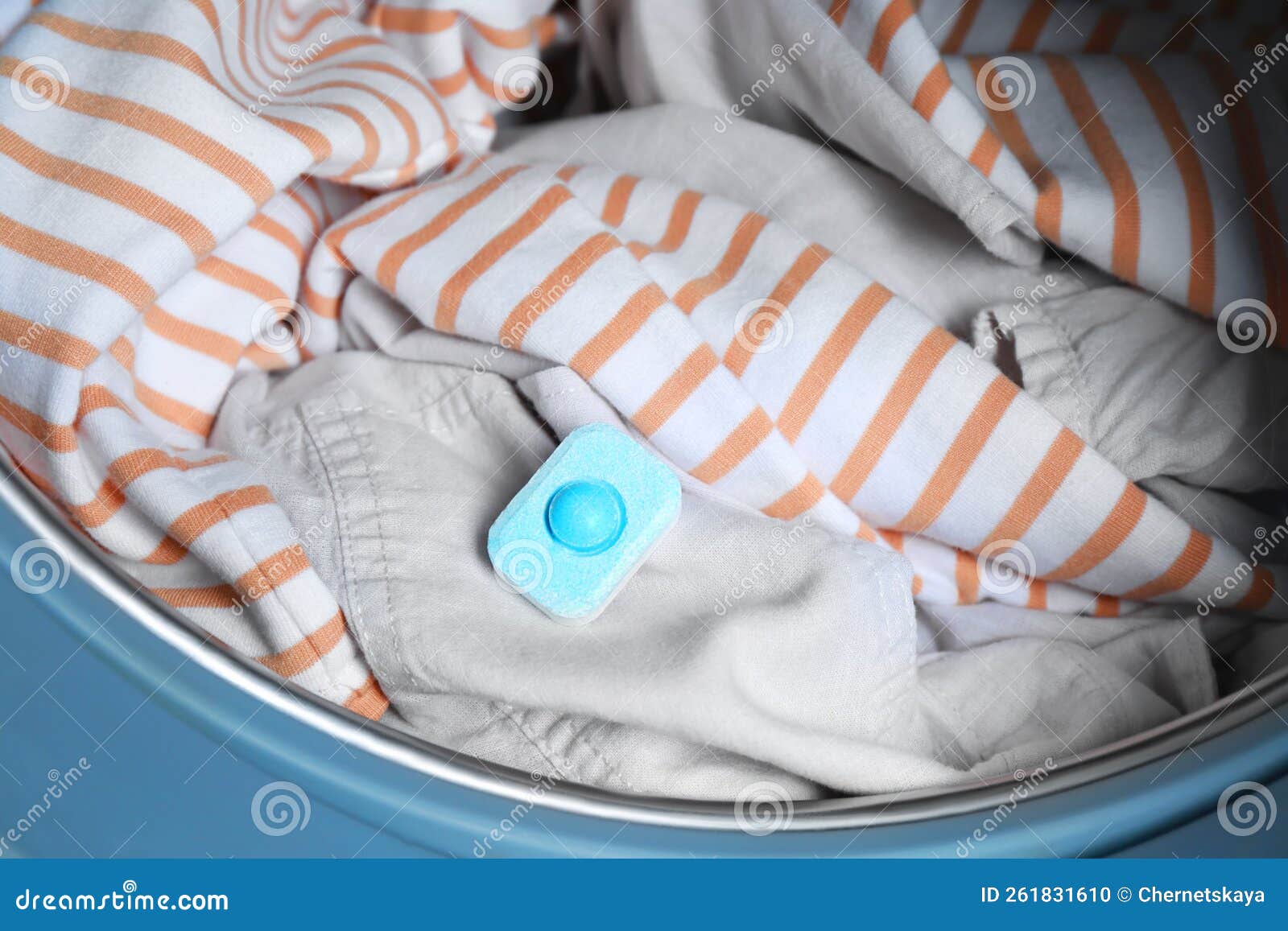 Water Softener Tablet on Clothes in Washing Machine, Closeup Stock ...