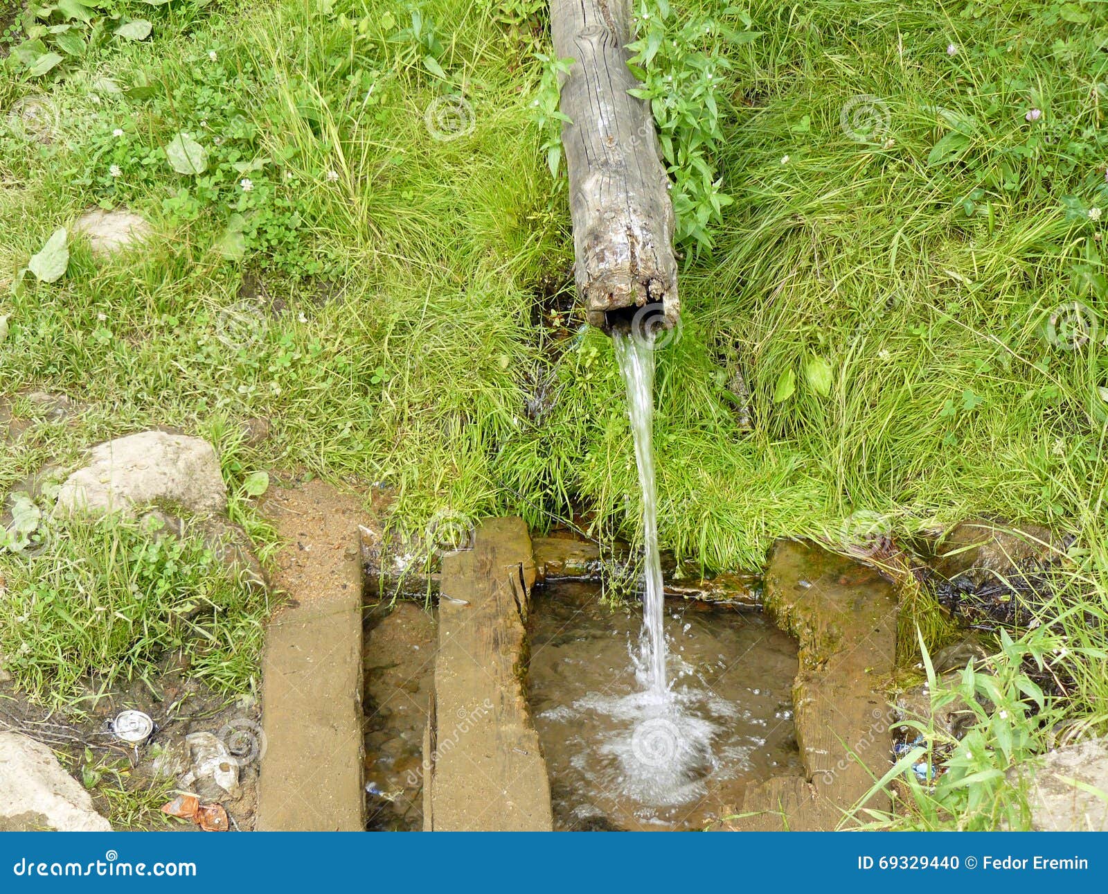 The Water Source Flowing from a Wooden Pipe Stock Photo - Image of ...