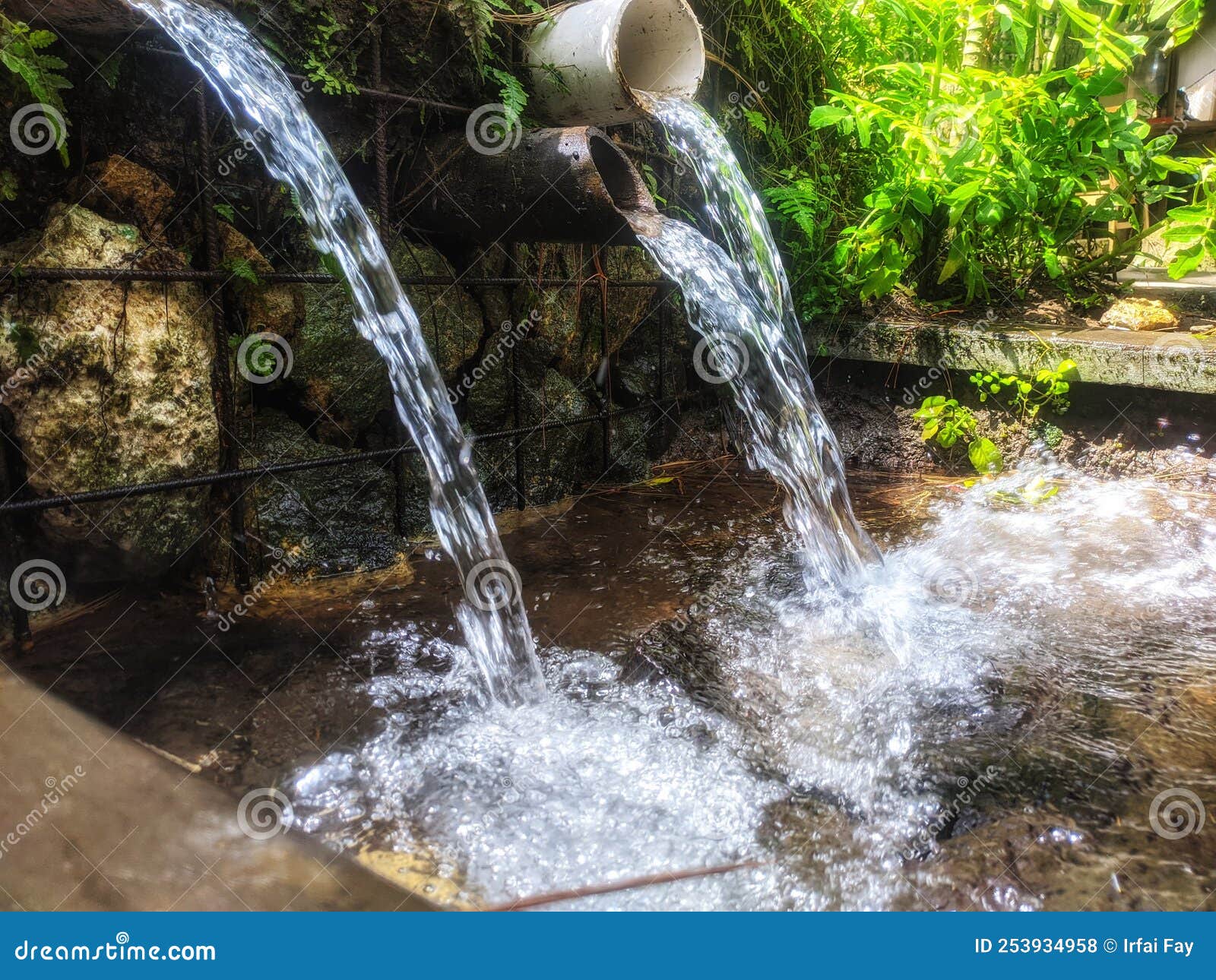 The Water Source from the Hill Flows through the Pipe Stock Photo ...