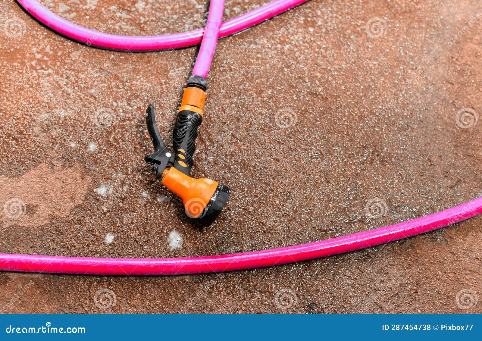 Water Spay Gun and Pipe on Wet Ground, Washing Tool Stock Photo - Image ...