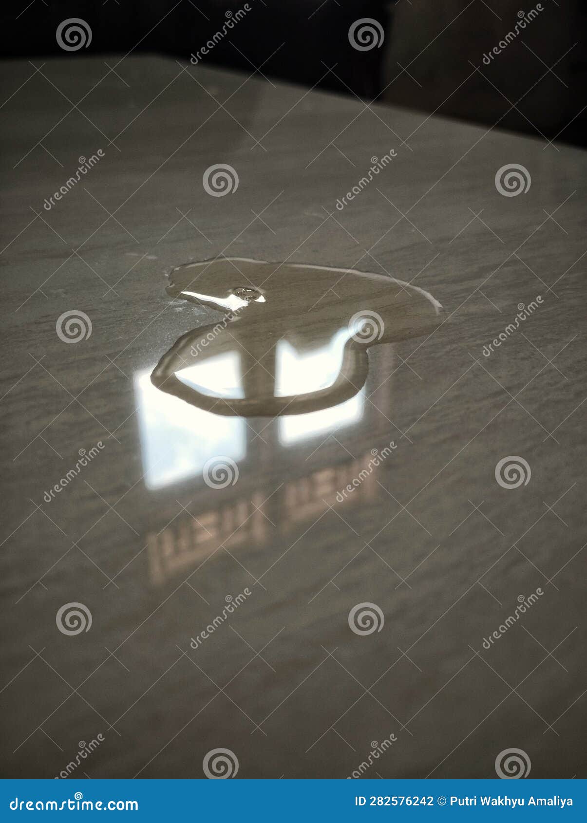 Water spill on the table stock photo. Image of table - 282576242