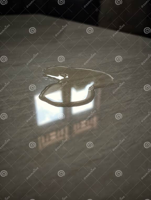 Water spill on the table stock photo. Image of table - 282576242
