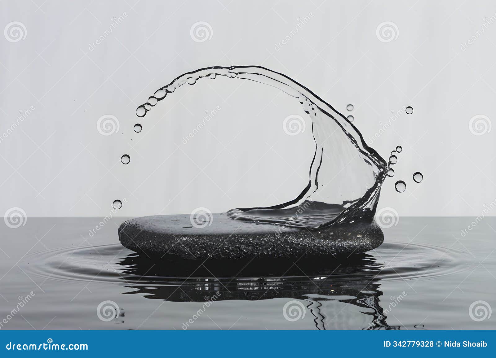 Water Splash Arcs Over Stone on Reflective Surface, Minimalist Contrast ...