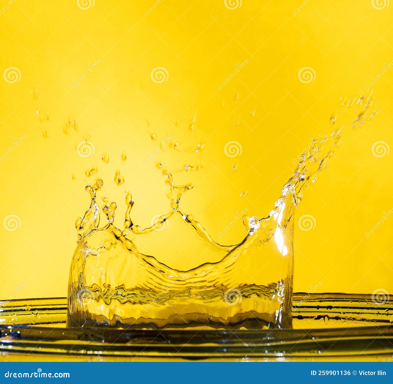 Water Splash on Bright Glowing Yellow Background Stock Photo - Image of ...