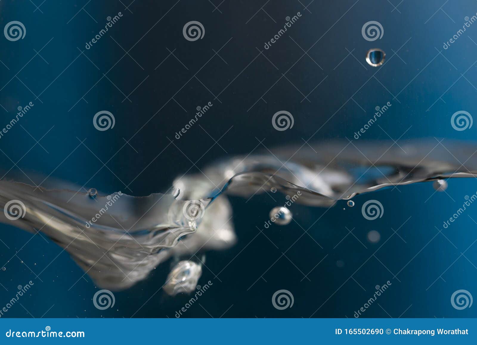 Water Splash with Bubbles. Splash of Water on Blue Background Stock ...
