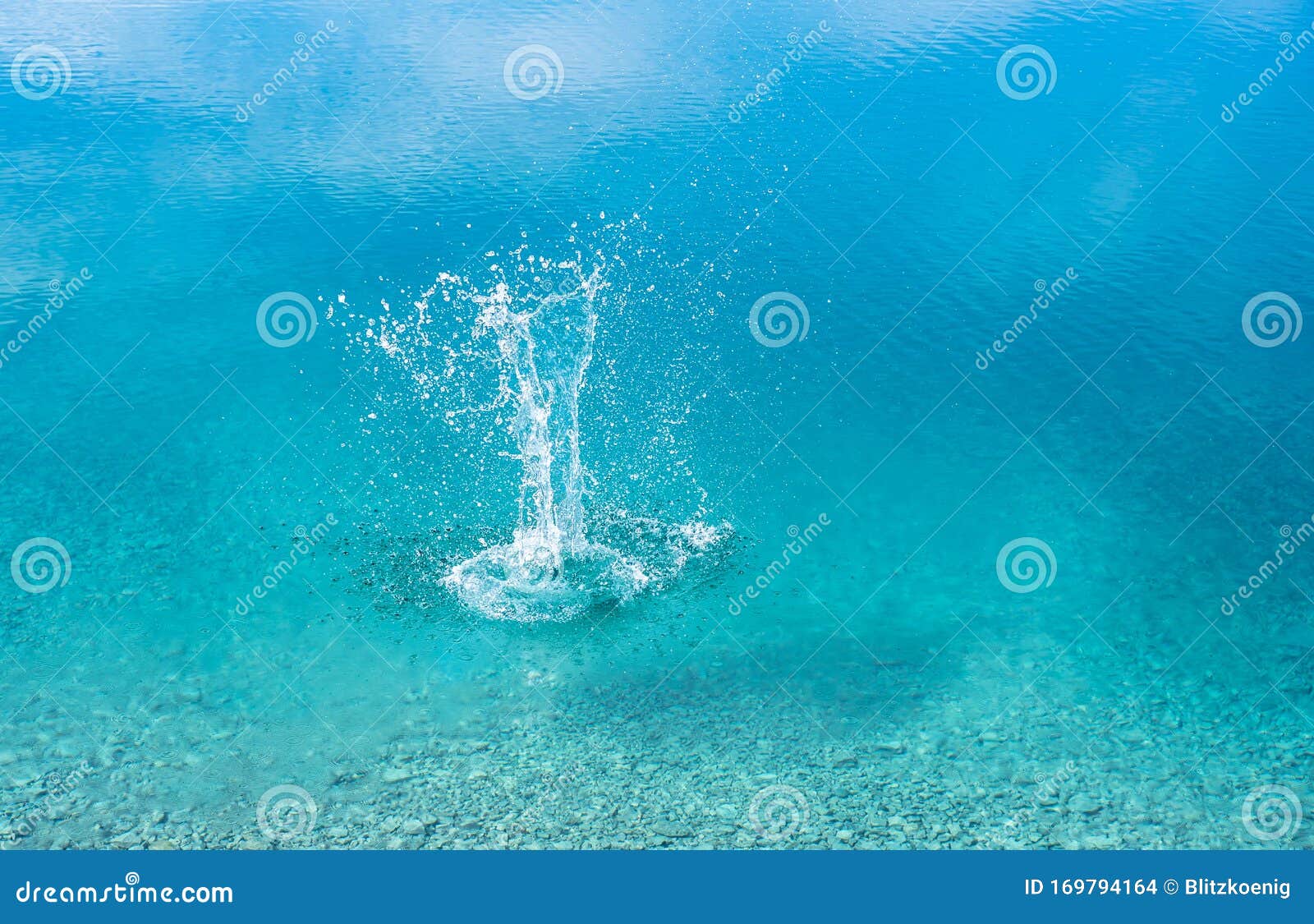 Water splash in a lake stock photo. Image of stand, nature - 169794164