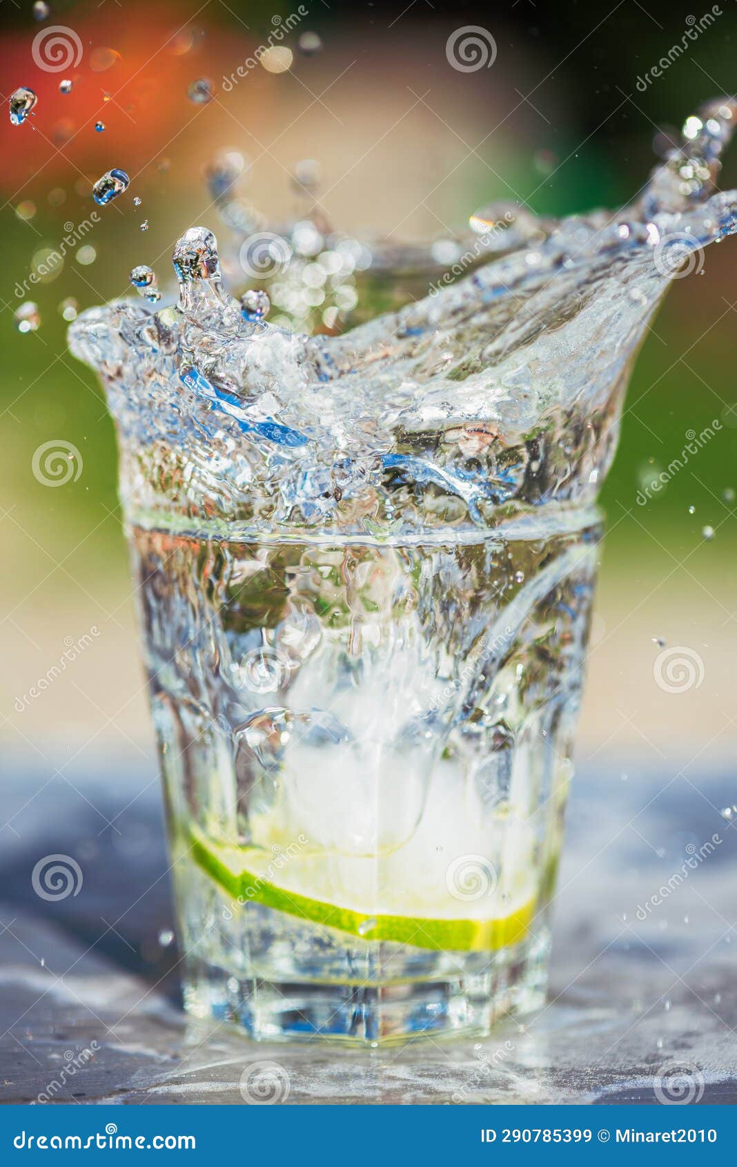Water Splash in Glass on Table in Garden Stock Image - Image of liquid ...