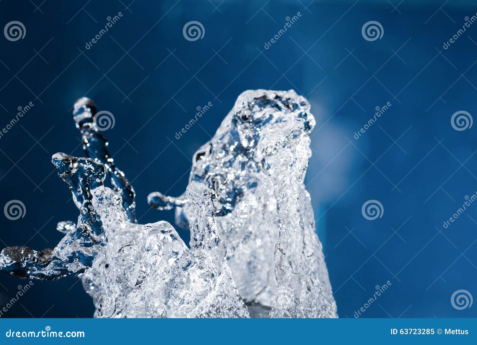 Water Splash Levitating in the Air on Blue Stock Image - Image of curve ...
