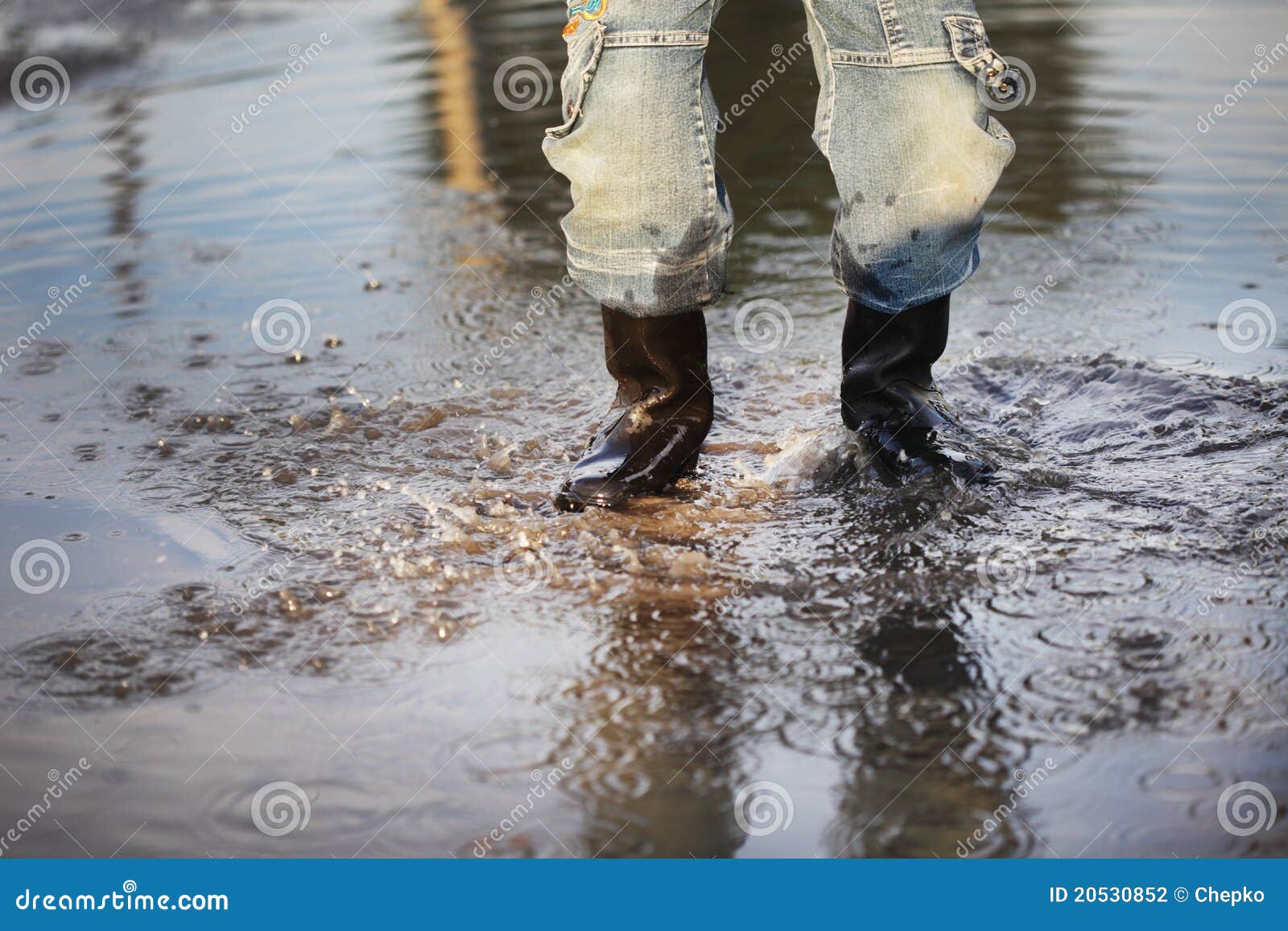 Water splash in puddle stock photo. Image of blue, child - 20530852
