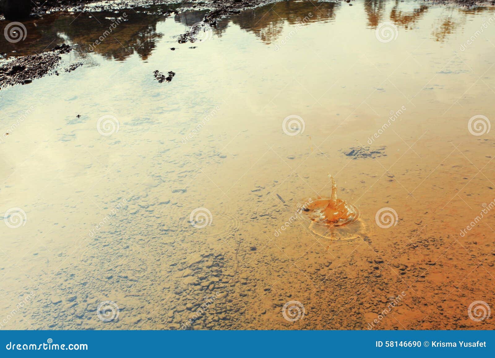 Water splash in the puddle stock photo. Image of drop - 58146690