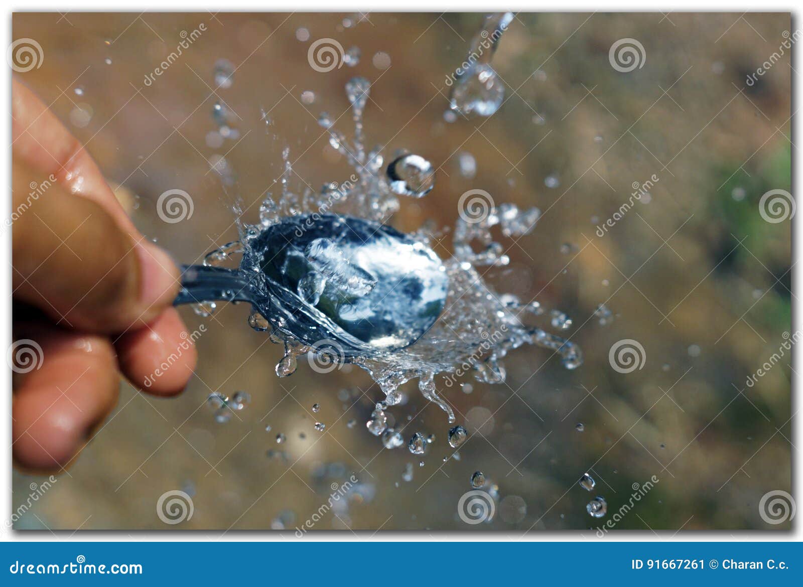Water Splash by a spoon stock image. Image of crystal - 91667261