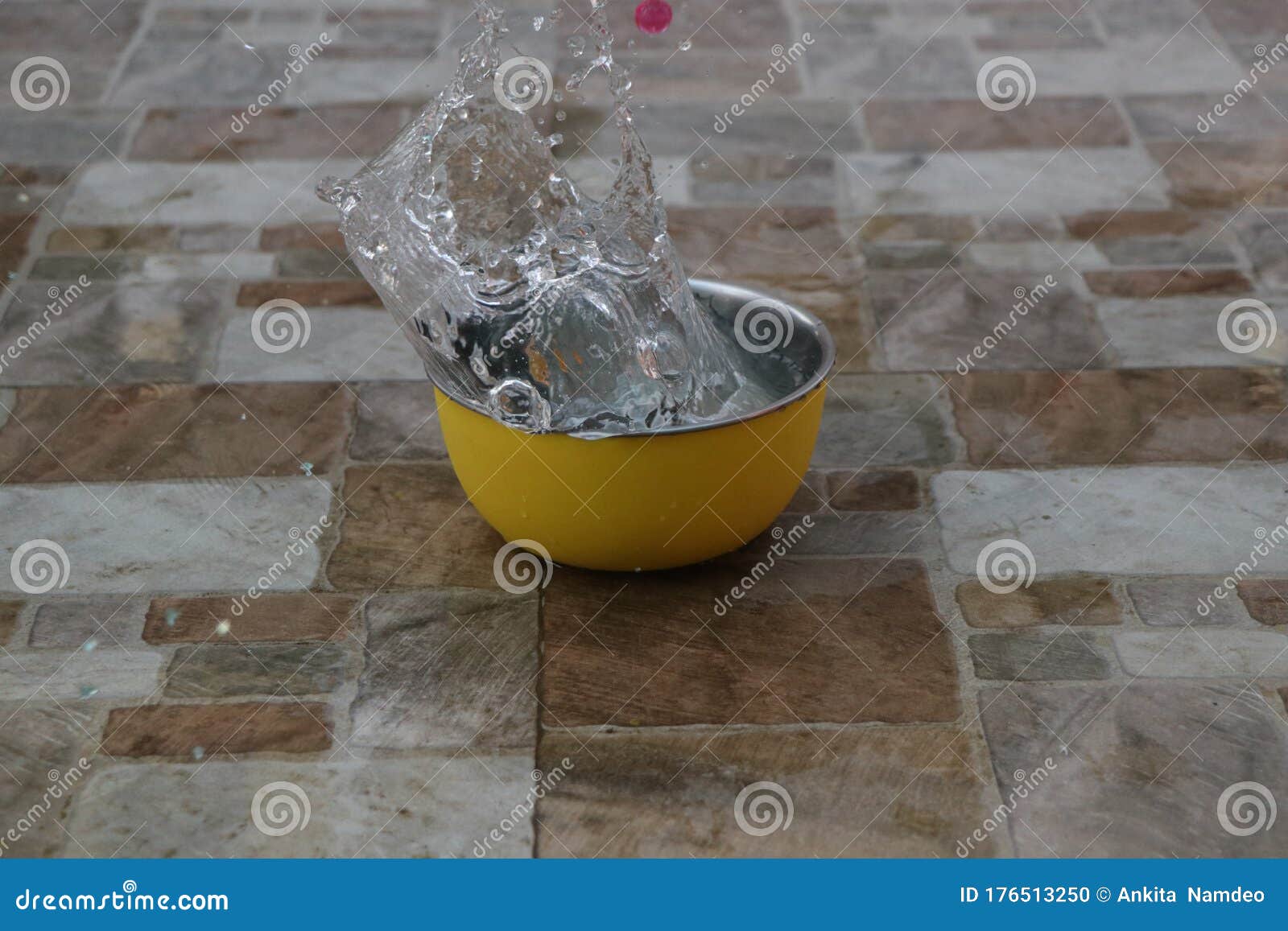 Water Splash in Yellow Color Bowl Stock Photo - Image of dripped, bowl ...
