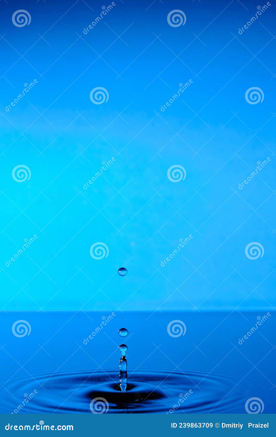 Water Splashes after Raindrop Falls.Blue Abstract Background with ...