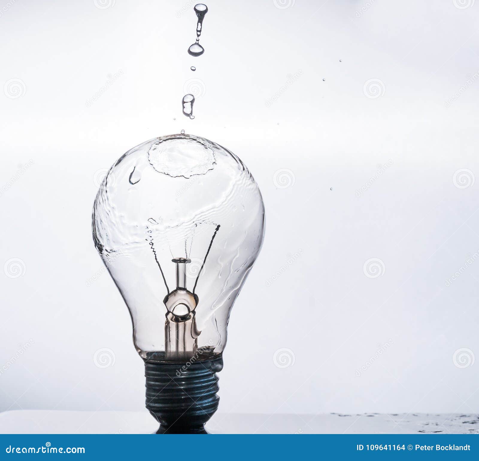 Water Splashing on a Light Bulb Stock Photo - Image of light, cool ...