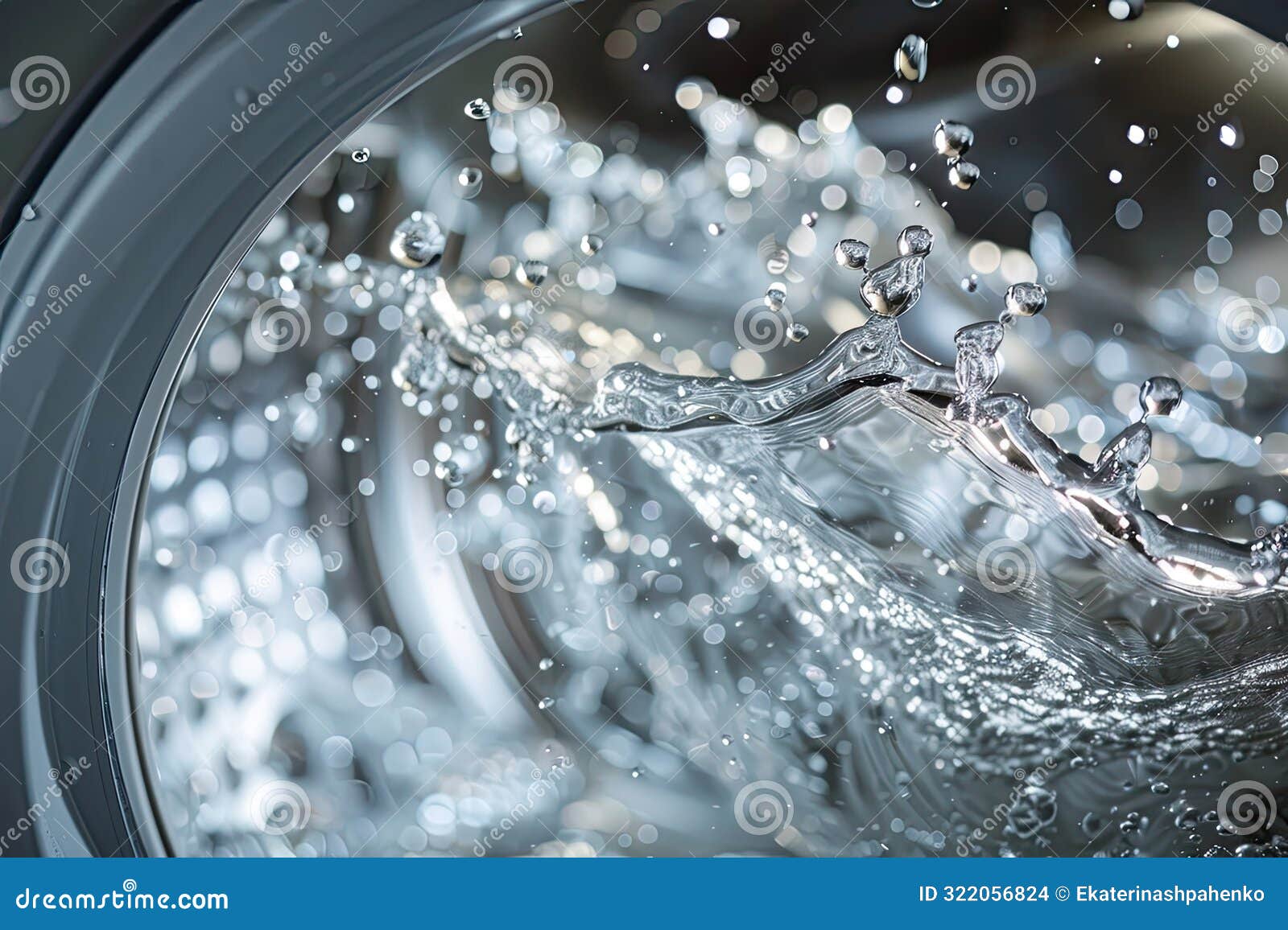 Water Splashing Out of the Washing Machine Drum, in a Closeup View ...