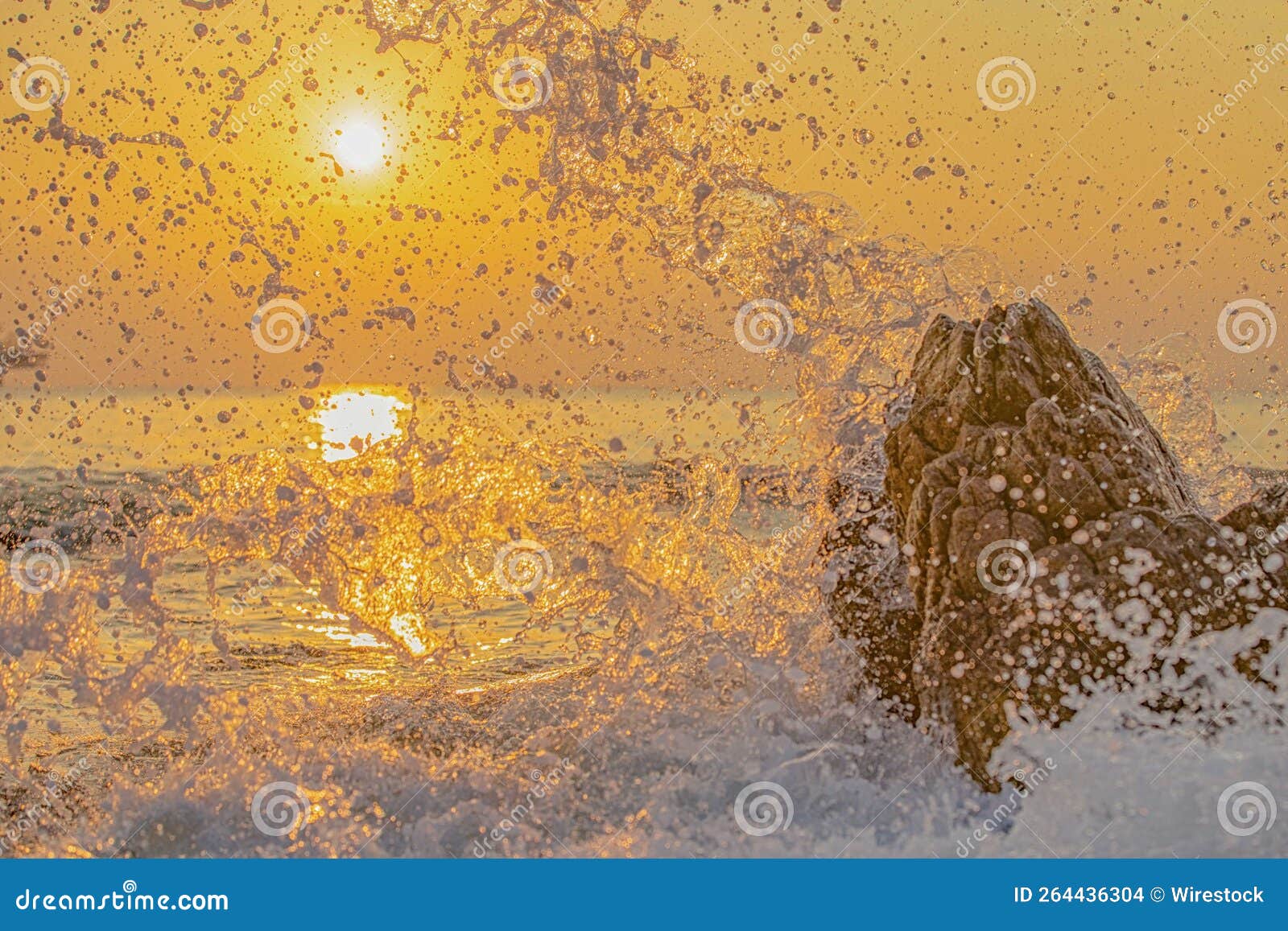 Water Splashing on the Rock at Sunset. Stock Photo - Image of rock ...