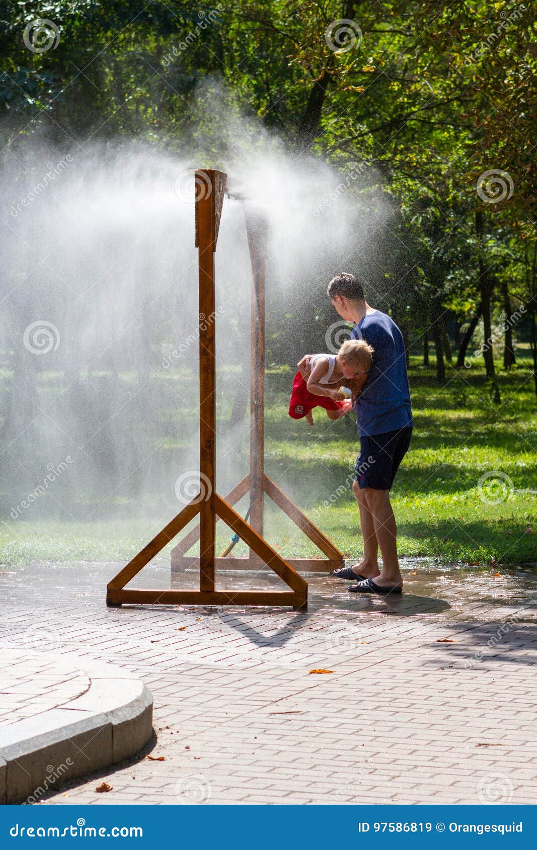Water spray in the park. editorial stock image. Image of spray - 97586819