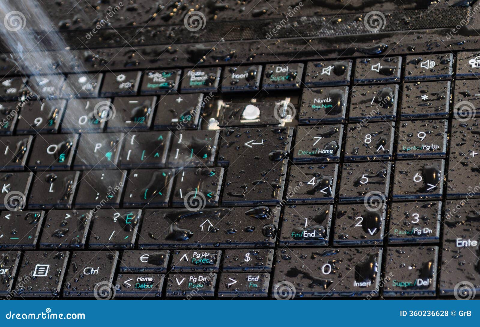 Water Spray Pouring Onto Bilingual European Computer Keyboard Laptop ...