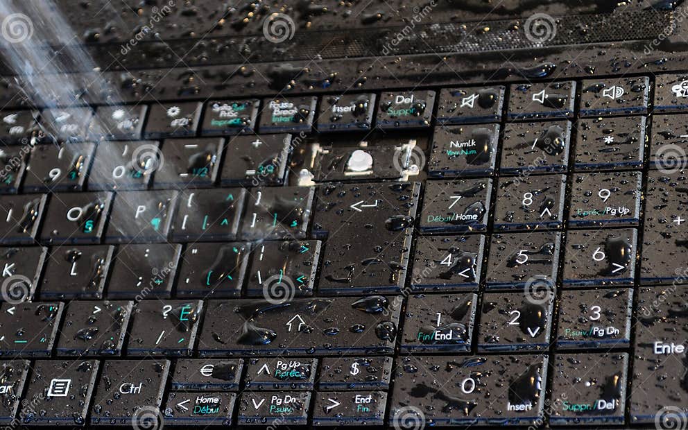 Water Spray Pouring Onto Bilingual European Computer Keyboard Laptop ...