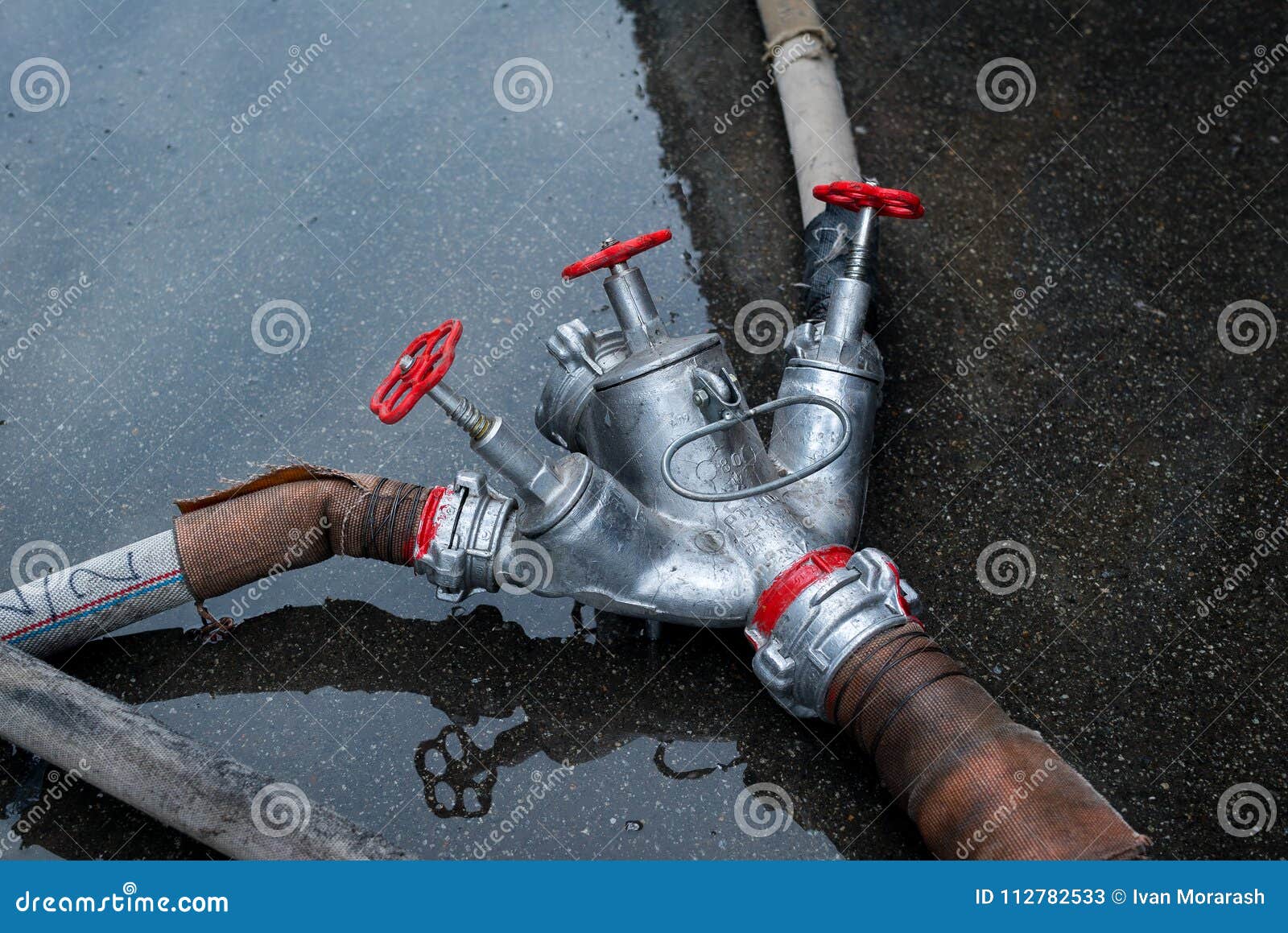 Fire Hose and Tee for Water on the Ground Stock Image - Image of burn ...