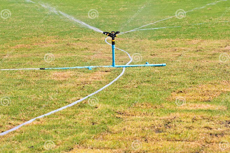 Water springer turning stock image. Image of ground, garden - 35218729