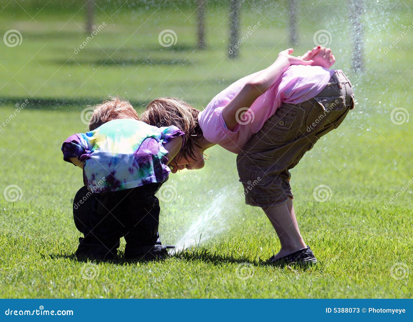 Water Sprinkler Fun stock image. Image of sister, cousins - 5388073