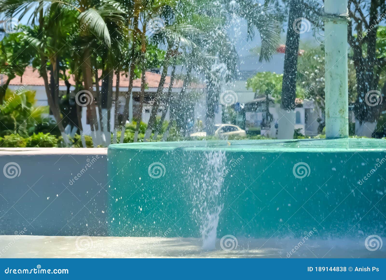 Water sprinkler in a pool stock photo. Image of vacation - 189144838