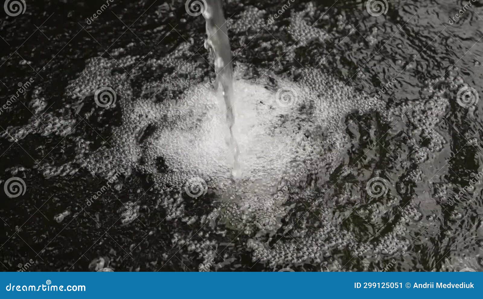 Water Stream Falls on Dark Surface, Creating Air Bubbles, Drop Splashes ...