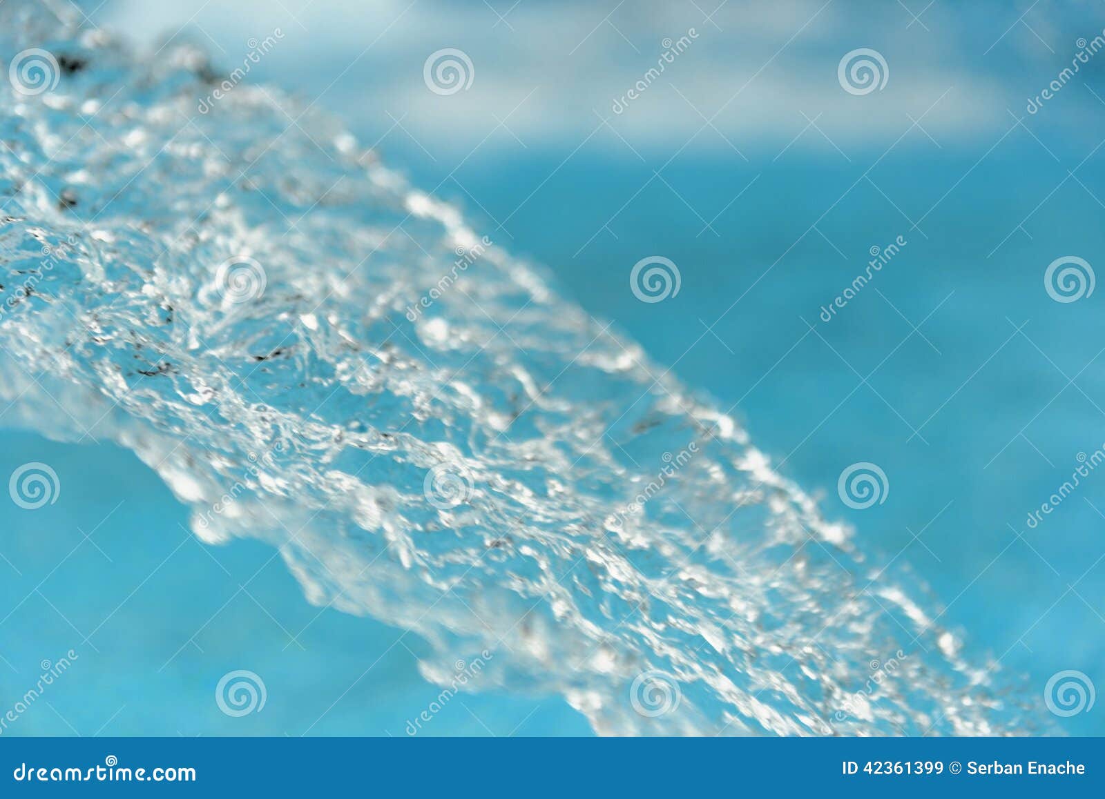 Water Stream With Splash Drops, Blue Background Stock Photo ...