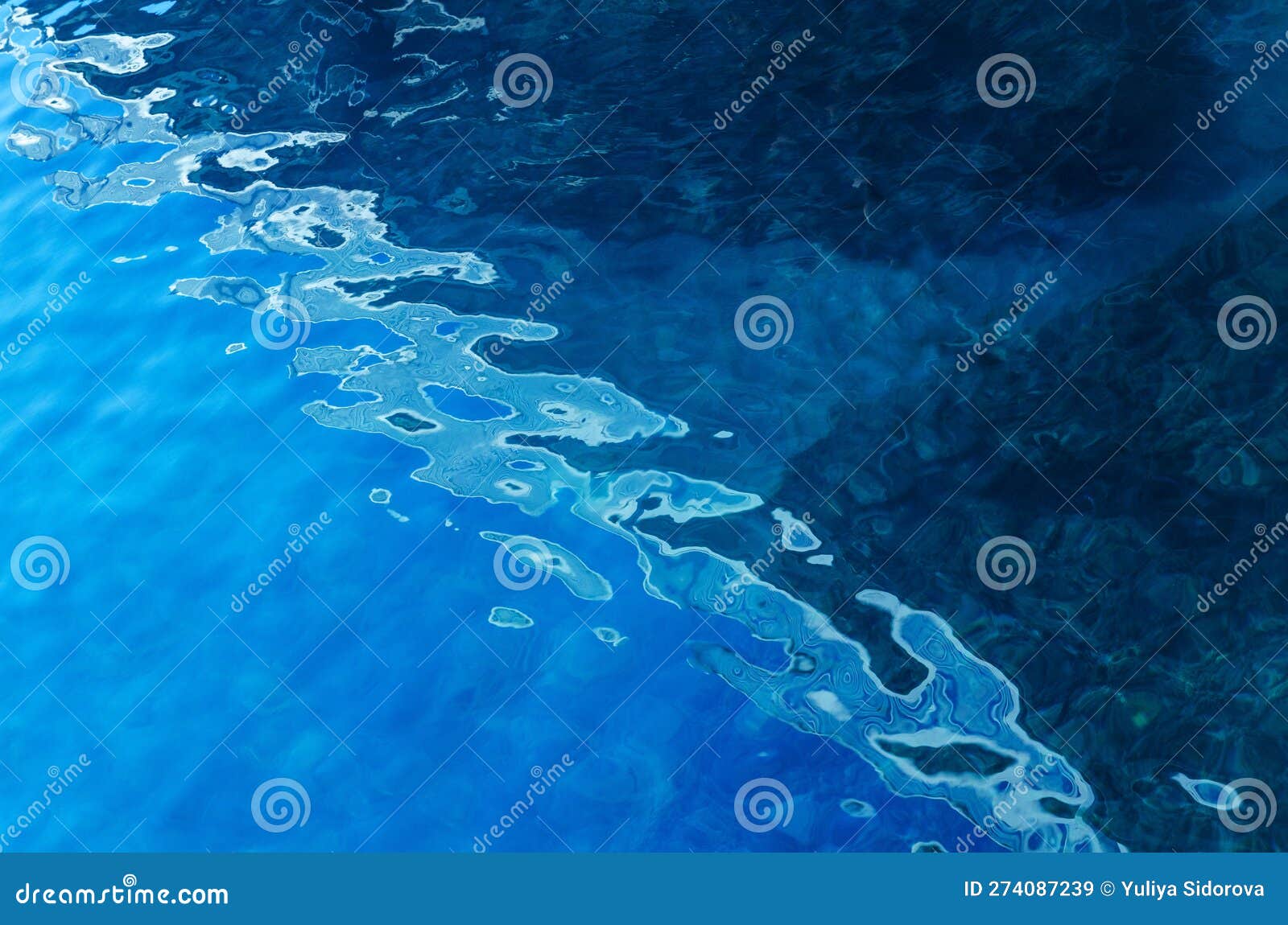 Water Surface Making Multiple Water Circles Against Blue Background ...
