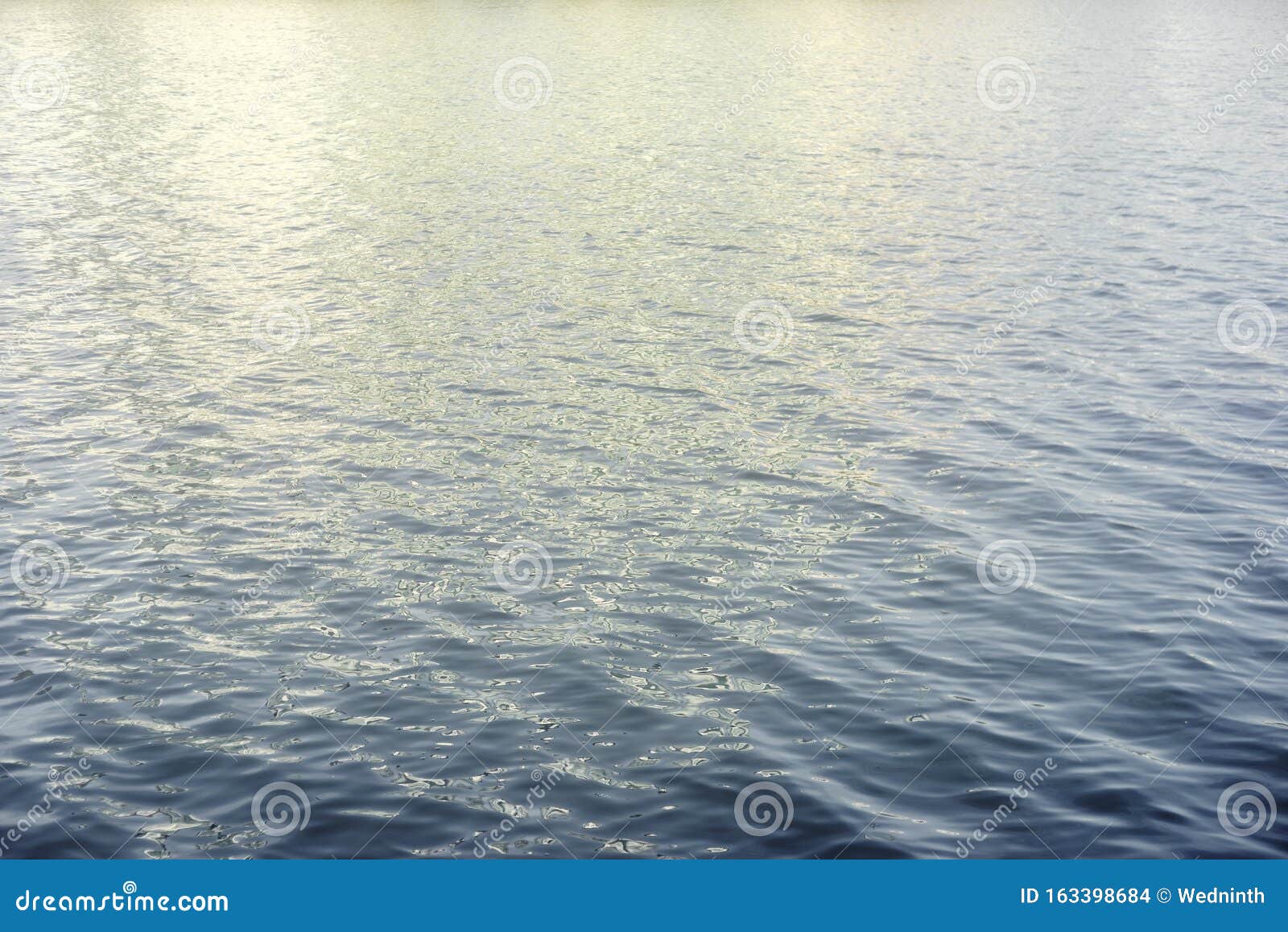 Water Surface with Ripples and Sunlight Reflections Stock Photo - Image ...