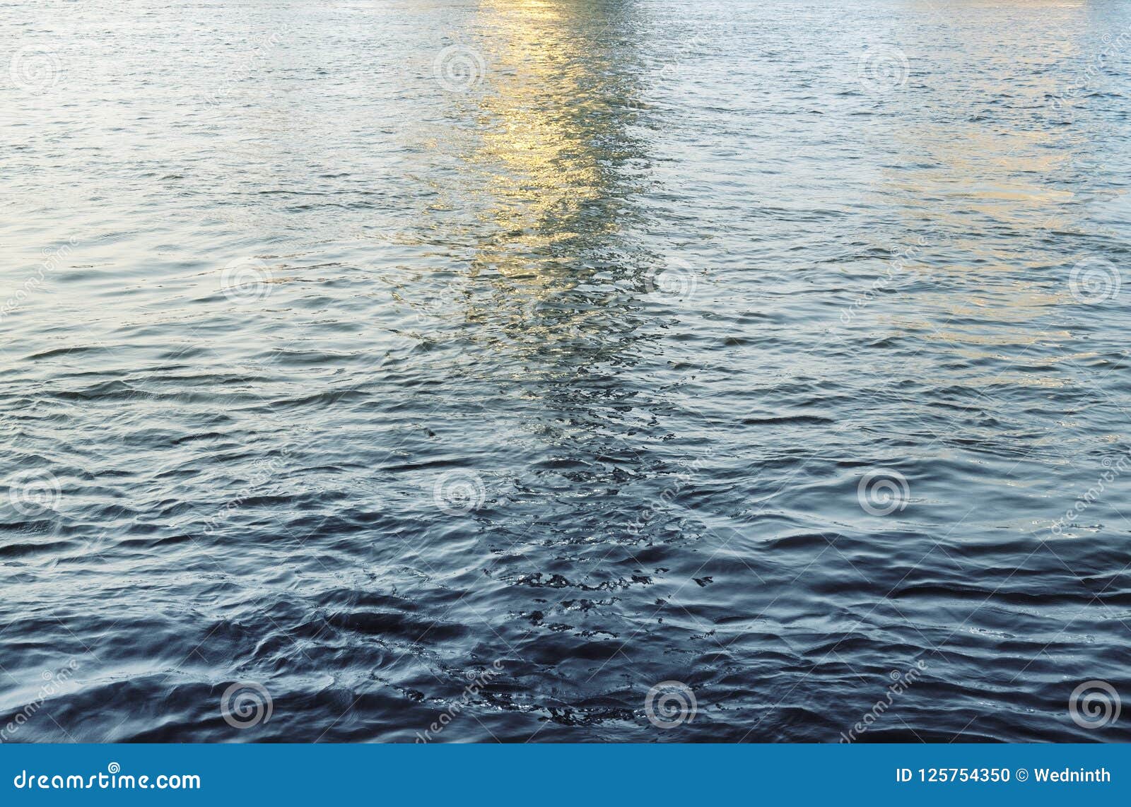 Water Surface with Ripples and Sunlight Reflections Stock Photo - Image ...