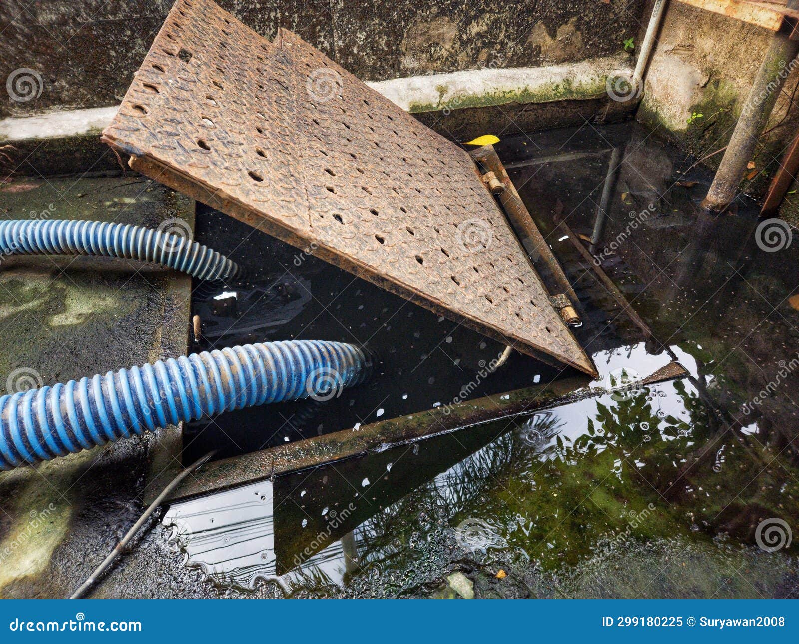 A Water Tank Filled with Dirty Water and Overflowing Stock Image ...
