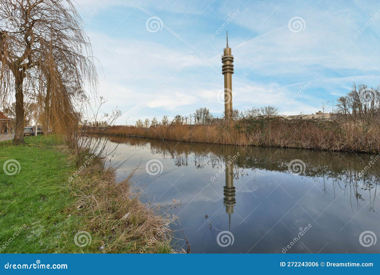 A River with a Tall Tower in the Background Stock Photo - Image of ...