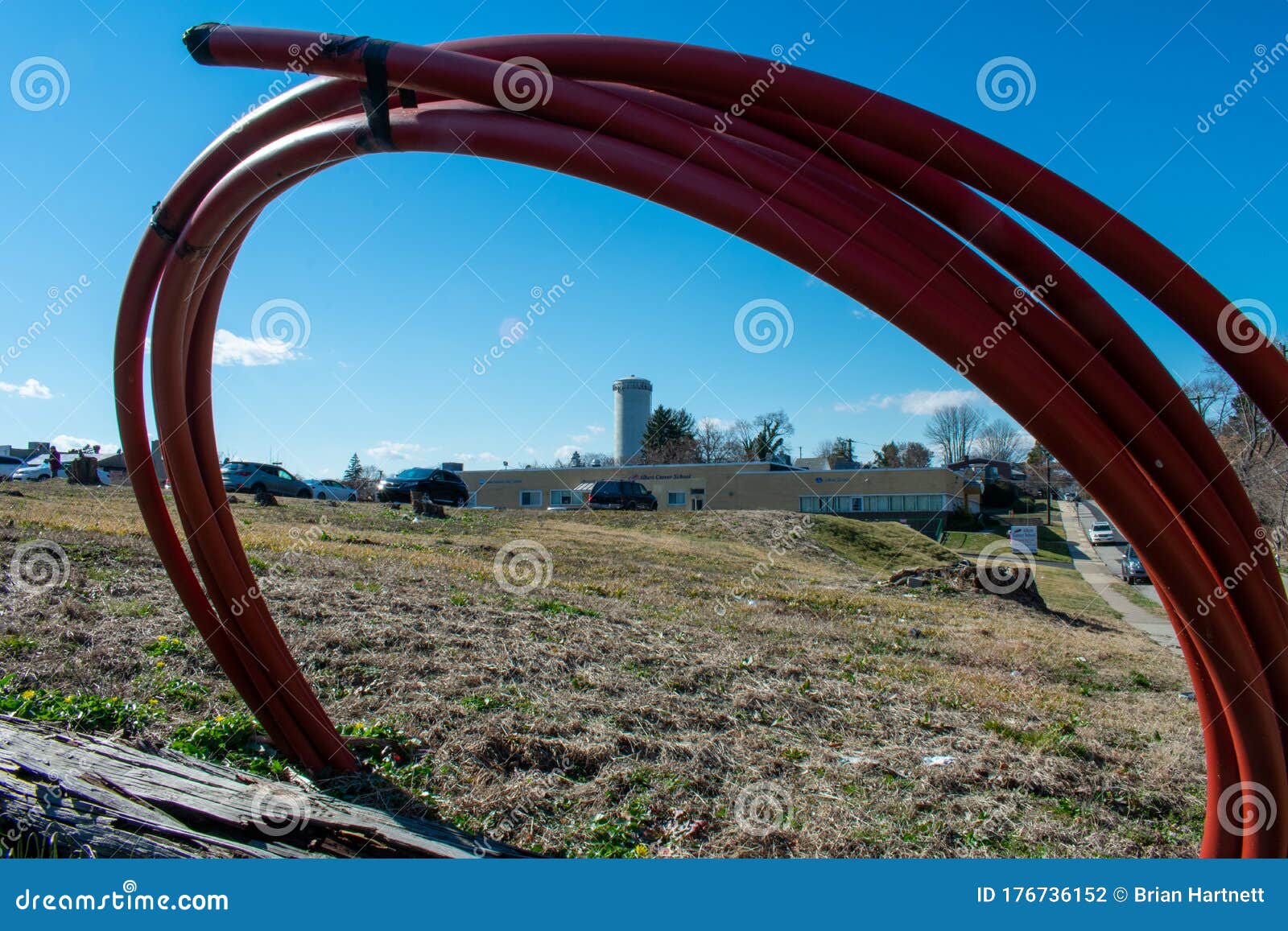 Looking through a Red Looped Pipe Stock Photo - Image of copy, clouds ...