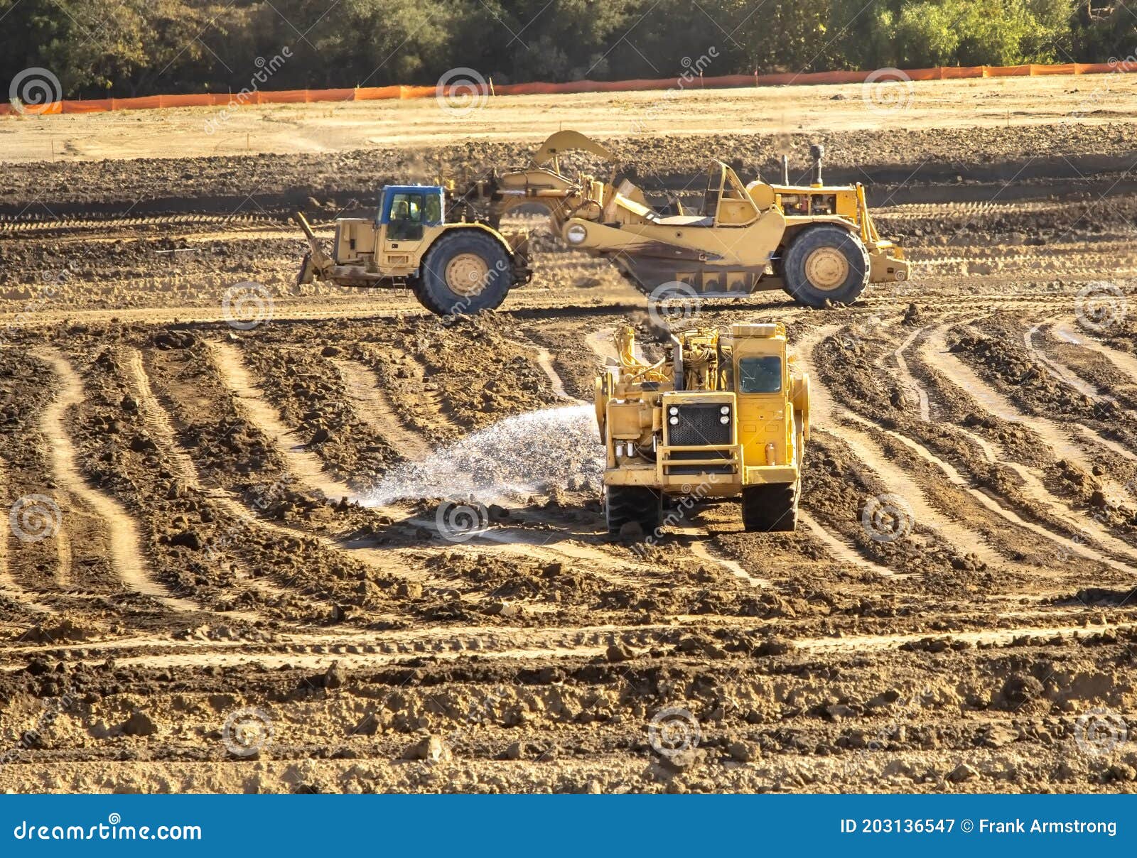 Water Truck Spraying Water on a Construction Site To Keep Dust from ...