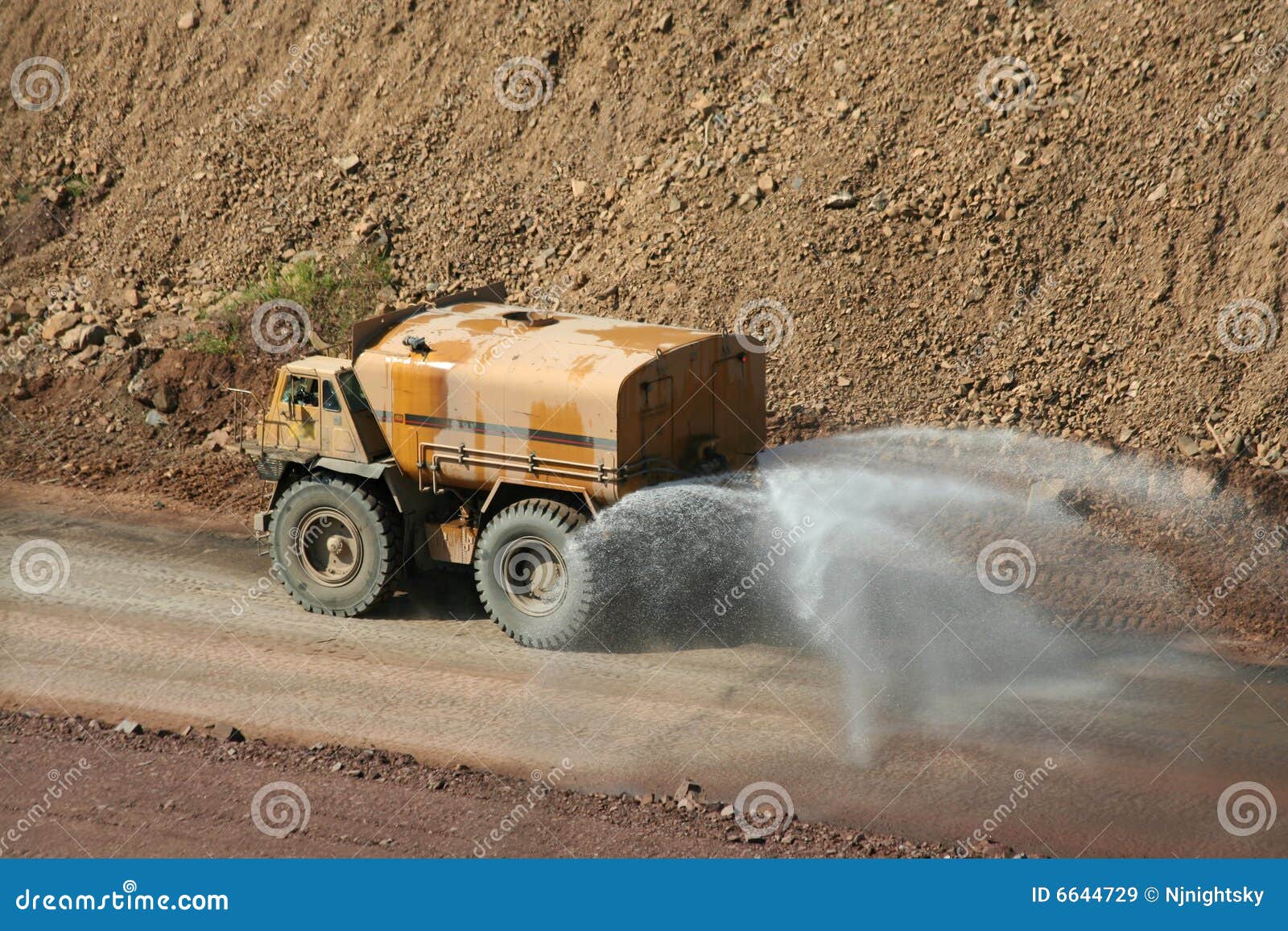 Water Truck Working at a Rock Quarry Stock Image - Image of rock ...