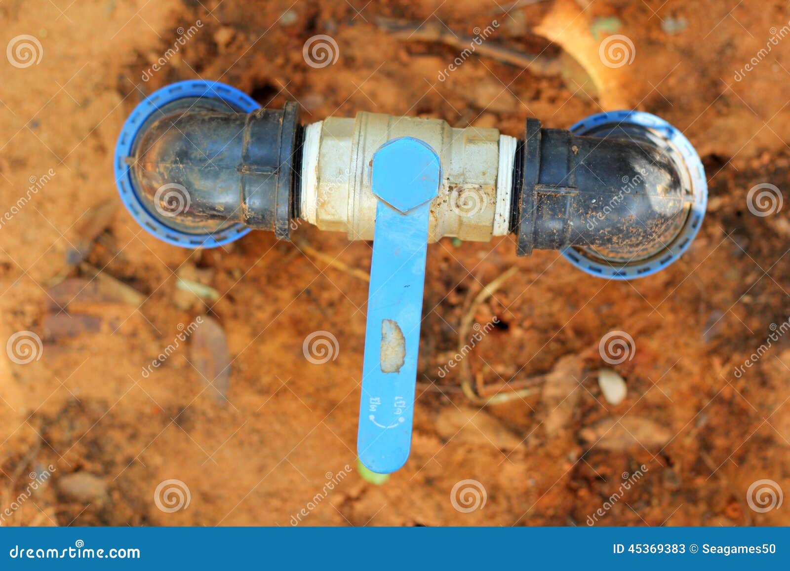 Water valve on the ground stock image. Image of conduit - 45369383