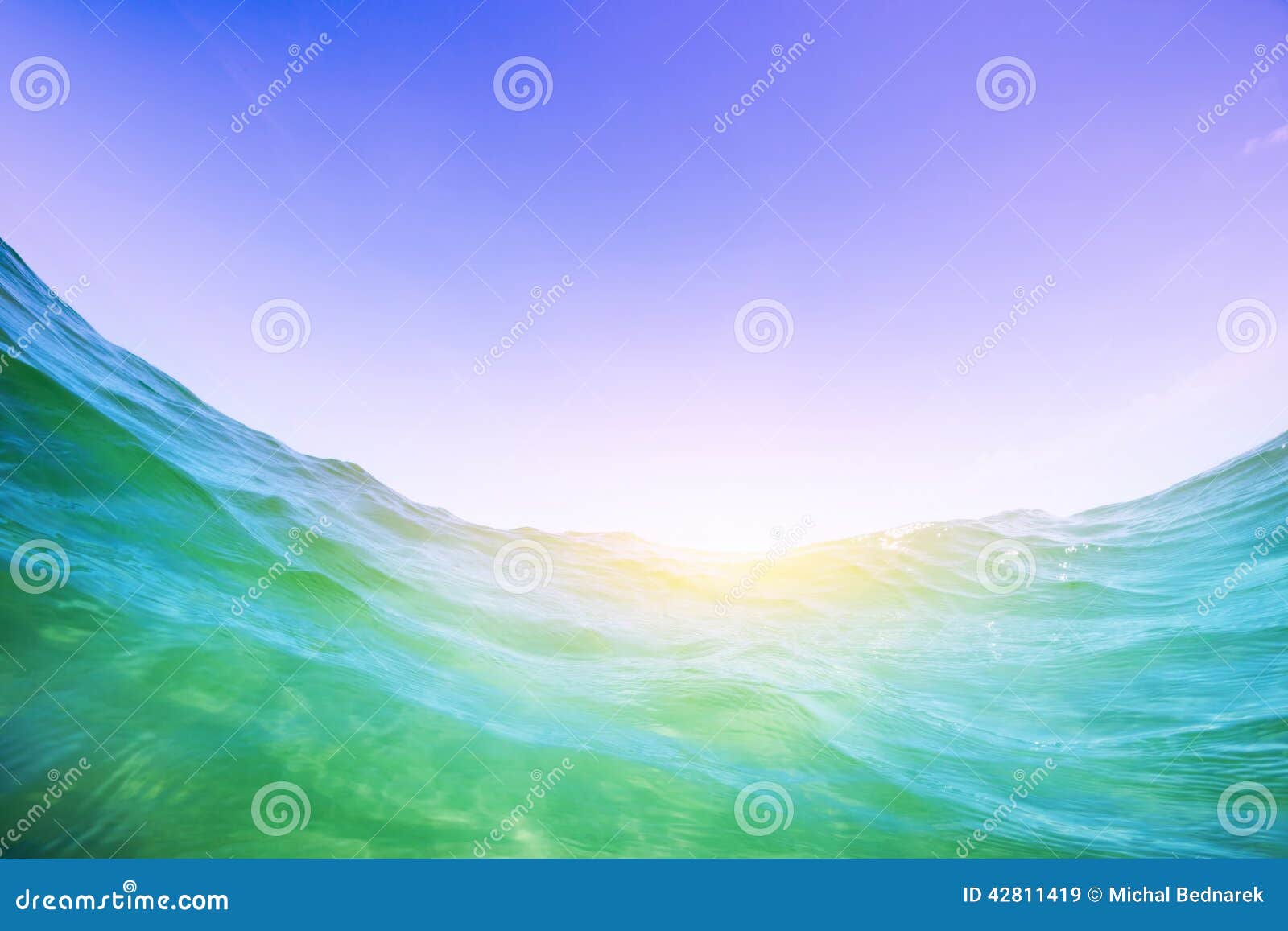 Water Wave in the Ocean. Underwater and Blue Sunny Sky. Stock Image ...